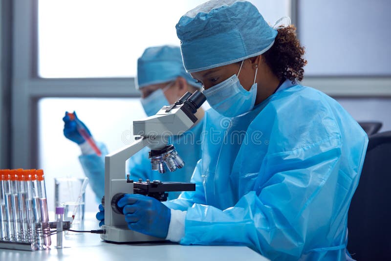 Female Lab Workers Wearing PPE Researching in Laboratory with ...