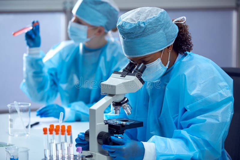 Female Lab Workers Wearing PPE Researching in Laboratory with ...