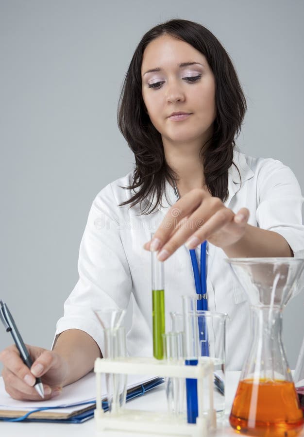 Female Laboratory Staff Working with Flasks Filled with Liquids Stock ...