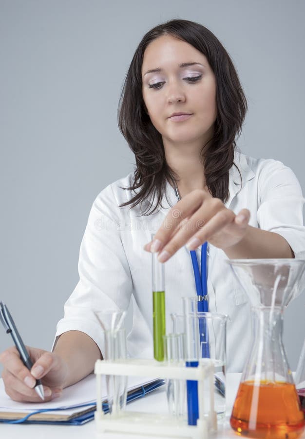 Female Laboratory Staff Working with Flasks Filled with Liquids Stock ...