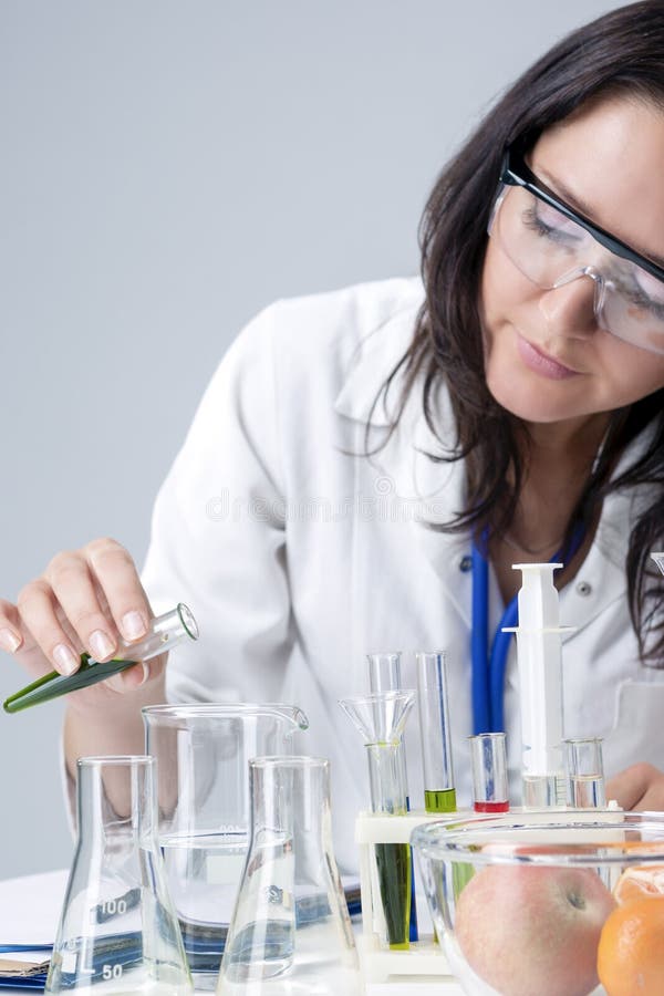 Female Laboratory Staff Working with Flasks Filled with Liquids Stock ...
