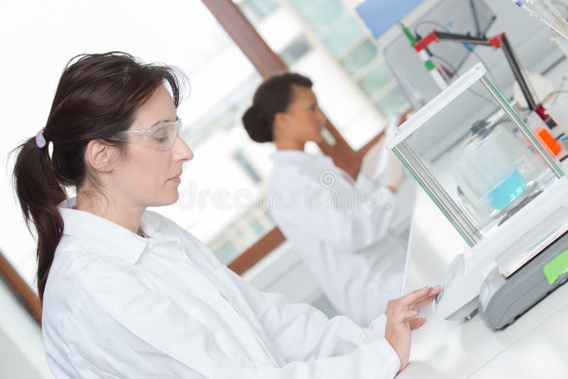 Female Laboratory Technician Using Electronic Scales Stock Image ...