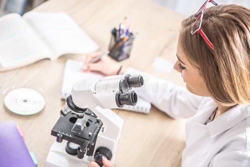 Work with a Microscope. Under the Microscope Stock Photo - Image of ...