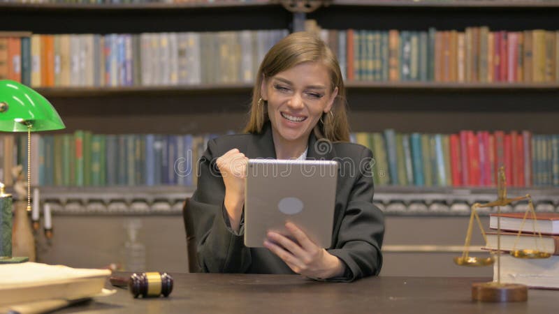 Female Lawyer Cheering Win on Tablet in Office Stock Photo - Image of ...