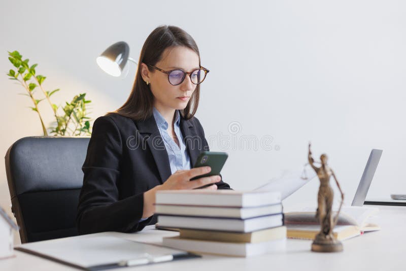 Female Lawyer In Strict Suit Works In Office Or Court Checks Clients