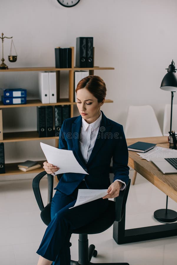 Female Lawyer in Suit with Documents in Hands at Workplace Stock Image ...