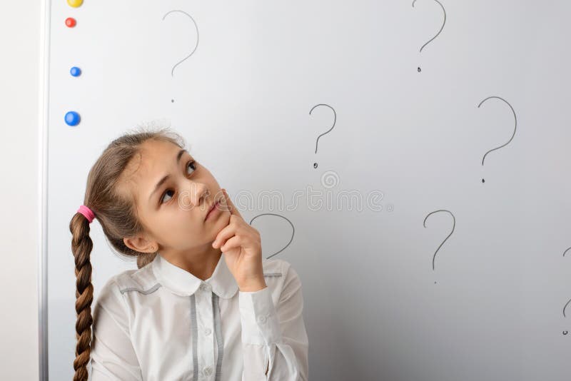 Female Learner of Secondary School Standing Near the Board and Thinking ...