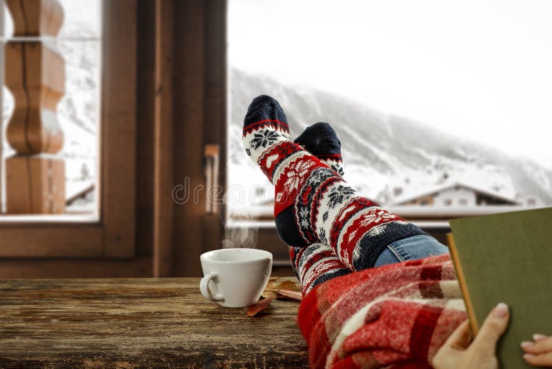 Female Legs in Winter Socks Resting on a Wooden Windowsill. Wooden ... Female Legs in Winter Socks Resting on a Wooden Windowsill. Wooden ...