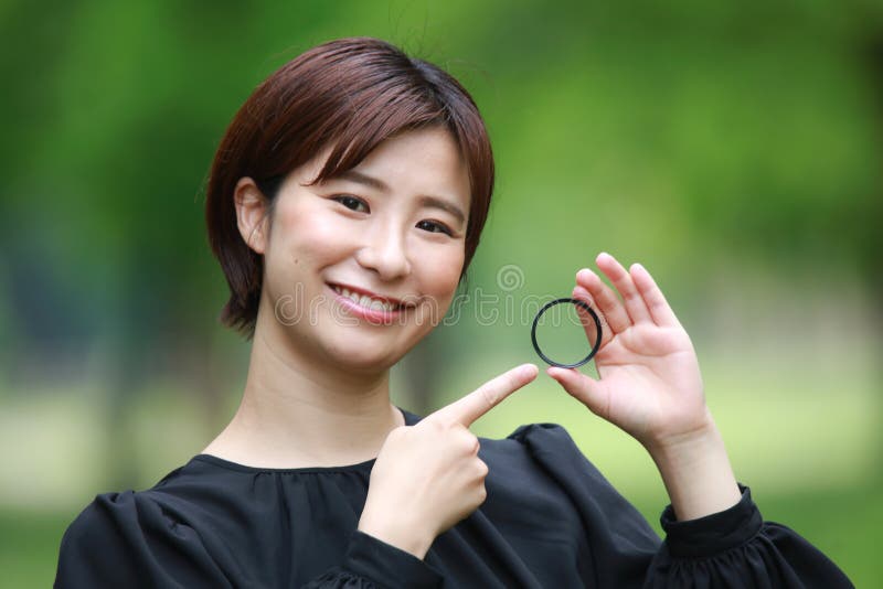 Female with lens filter stock image. Image of outing - 238934225