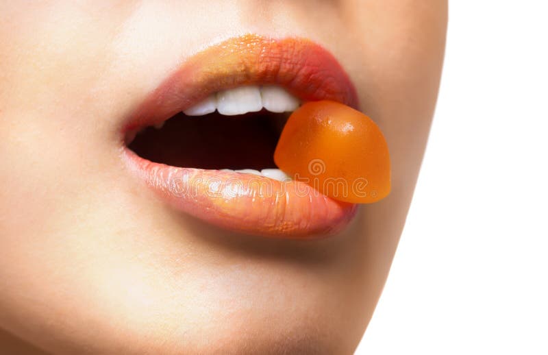 Female lips with candy stock photo. Image of fashion - 68285160