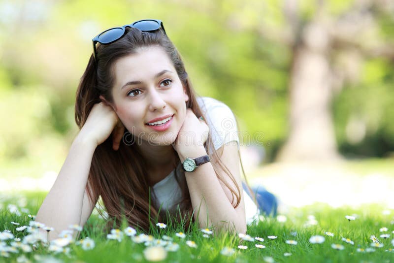 Female lying on grass stock image. Image of relaxing - 25247169
