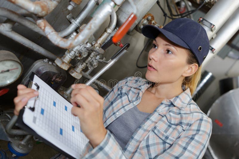 Female Machine Technician Doing Inspection Stock Photo - Image of ...