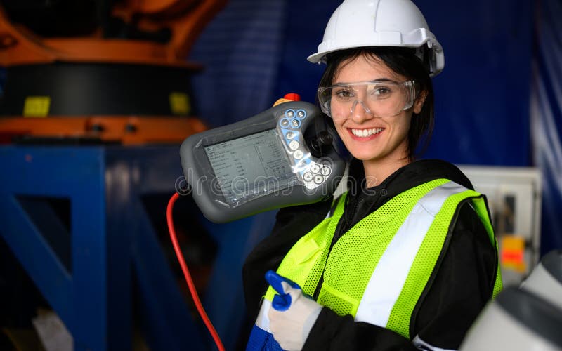 Female Maintenance Worker with Machine Robotic Arms at Industrial ...