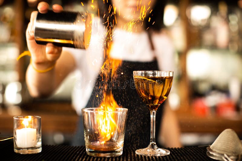 Female Making a Special Alcoholic Drink with Fire Flames in a Pub Stock ...