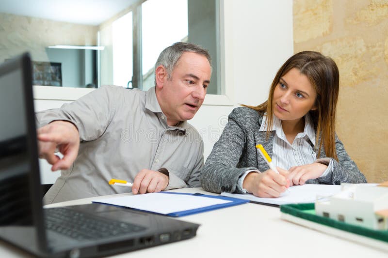 Female and Male Architect Talking in Office Stock Image - Image of ...
