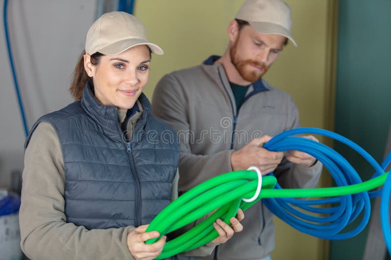 Female and Male Electrician Installing Electrical Wiring Stock Image ...