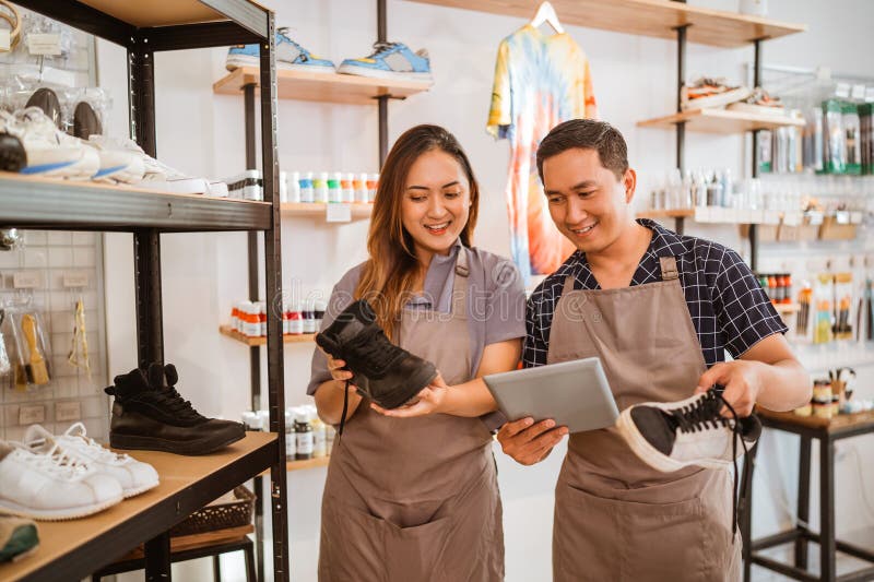 Female and Male Staff Checking Products Stock Photo - Image of fashion ...