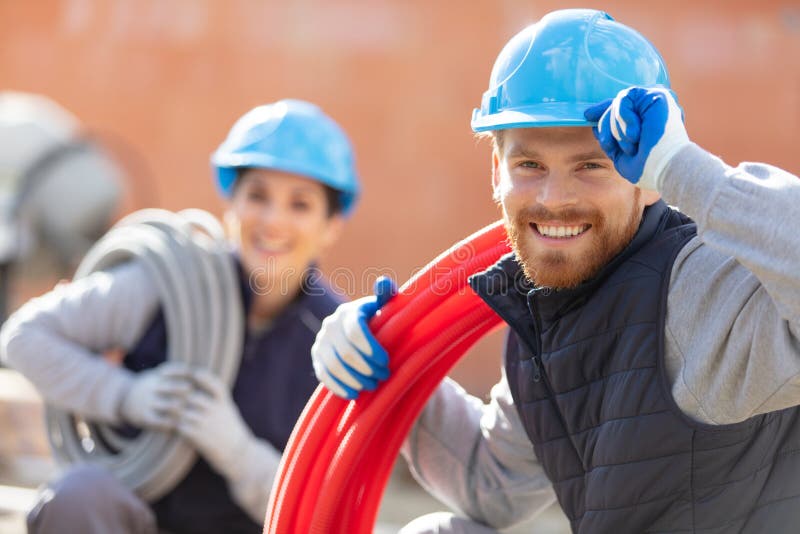 Female and Male Workers with Electrical Cable Stock Image - Image of ...