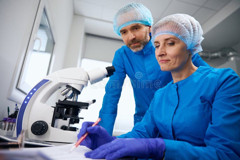 Female and Male at the Workplace in a Modern Laboratory Stock Photo ...
