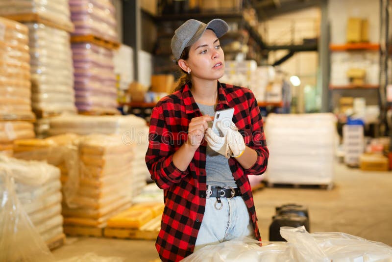 Female Manager Keeps Records of Bulk Construction Materials in the ...