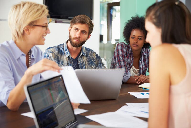 Female Manager Leading Meeting in Office Stock Photo - Image of black ...