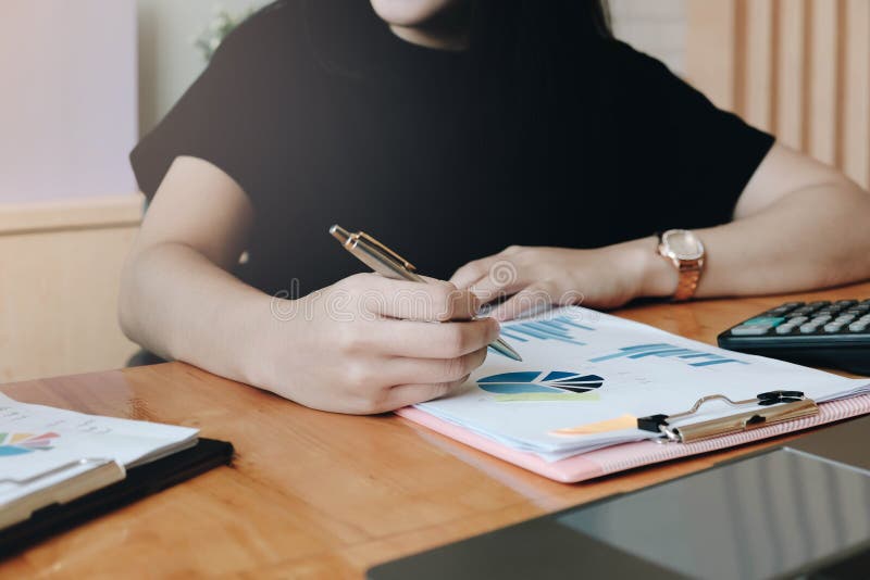 Female Manager Putting His Ideas and Writing Business Plan at Workplace ...