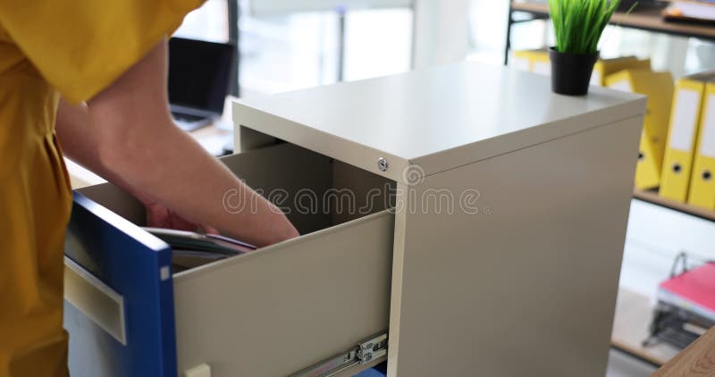 Female Manager Takes Stack of Project Documents from Drawer Stock ...