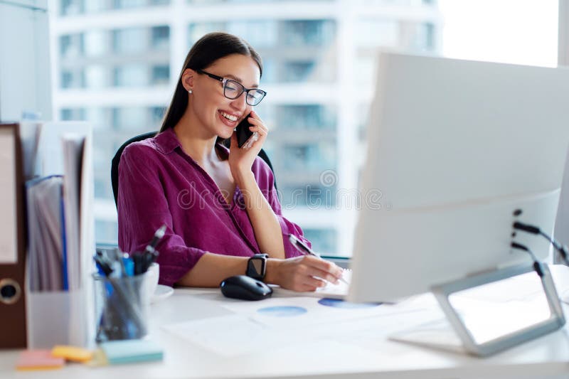 Female Manager Talking Cellphone Taking Notes Sitting Her Desk Office ...