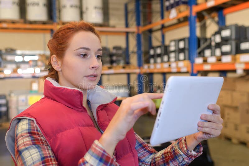 Female Manager Using Digital Tablet in Warehouse Stock Photo - Image of ...