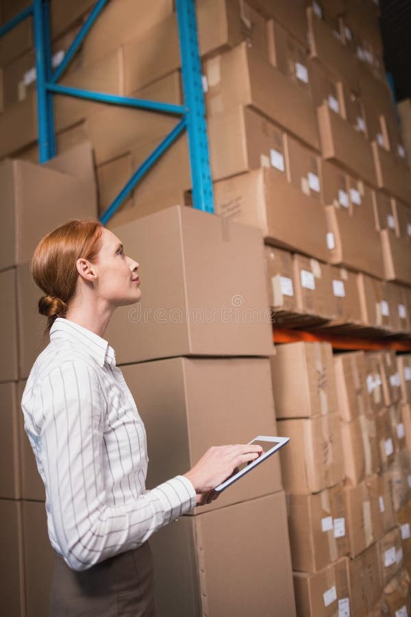 Female Manager Using Digital Tablet in Warehouse Stock Image - Image of ...