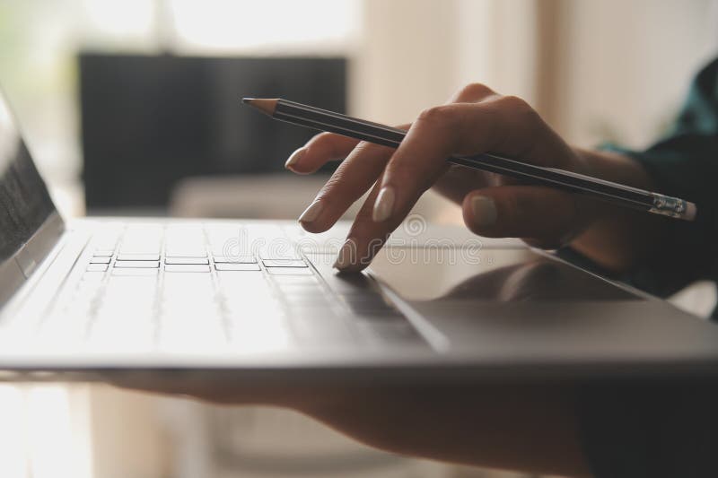 Female Manager Using Laptop Computer To Check Inventory. in the ...