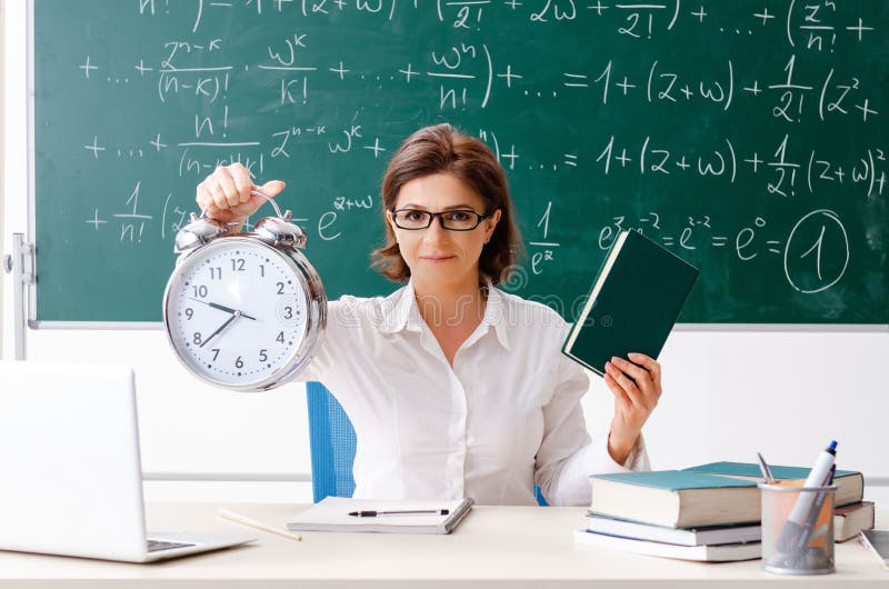The Female Math Teacher in Front of the Chalkboard Stock Photo - Image ... The Female Math Teacher in Front of the Chalkboard Stock Photo - Image ...