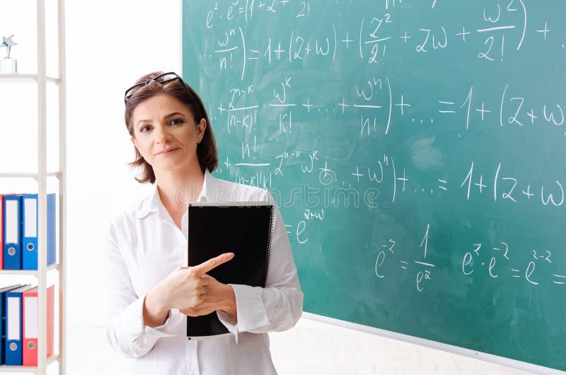 The Female Math Teacher in Front of the Chalkboard Stock Image - Image ...