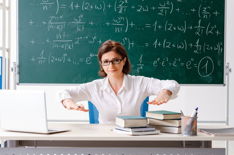 The Female Math Teacher in Front of the Chalkboard Stock Image - Image ...