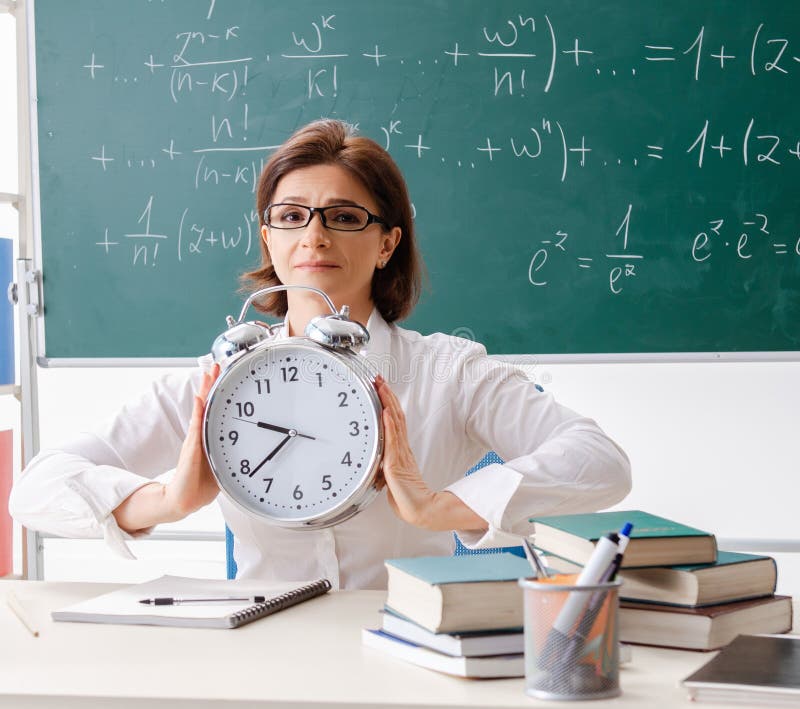 Female Math Teacher in Front of the Chalkboard Stock Image - Image of ...