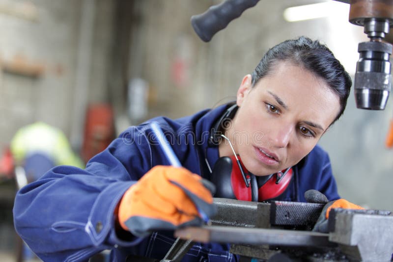 Female Mechanic Apprentice Working on Milling Machine Stock Photo ...