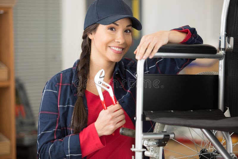 Female Mechanic Fixing Wheelchair Stock Image - Image of profession ...