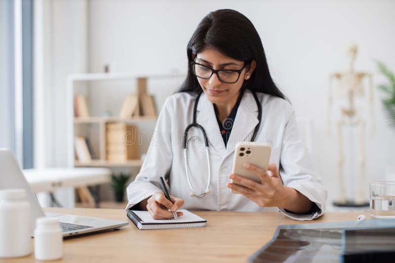 Female Medic Making Consultation Online Using Smartphone Stock Photo ...