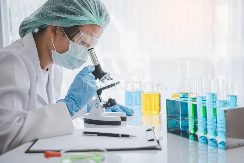 Female Researchers are Experimenting with Pipette Dropping a Sample ...