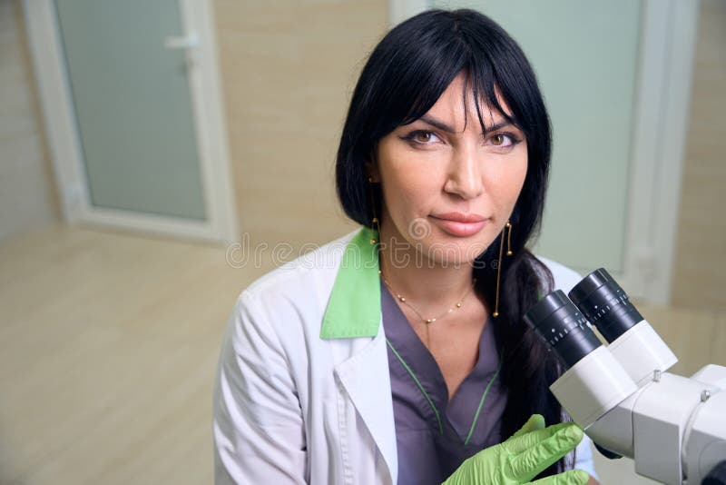Female Medical Scientist Looking At Camera During Working With Microscope Stock Image Image Of