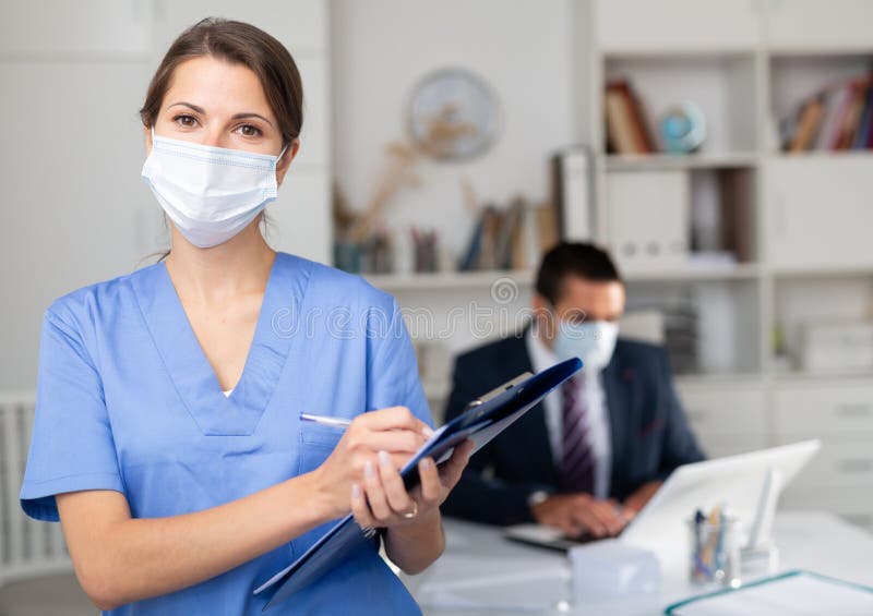 Female Medical Worker Meeting Staff in Office, Monitoring Health Status ... Female Medical Worker Meeting Staff in Office, Monitoring Health Status ...