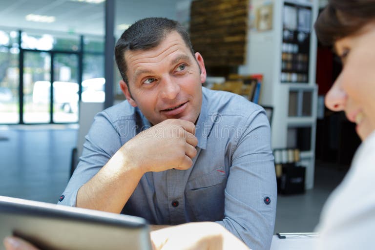 Female Merchandiser Entertaining Client Stock Image - Image of store, tiles: 287866885
