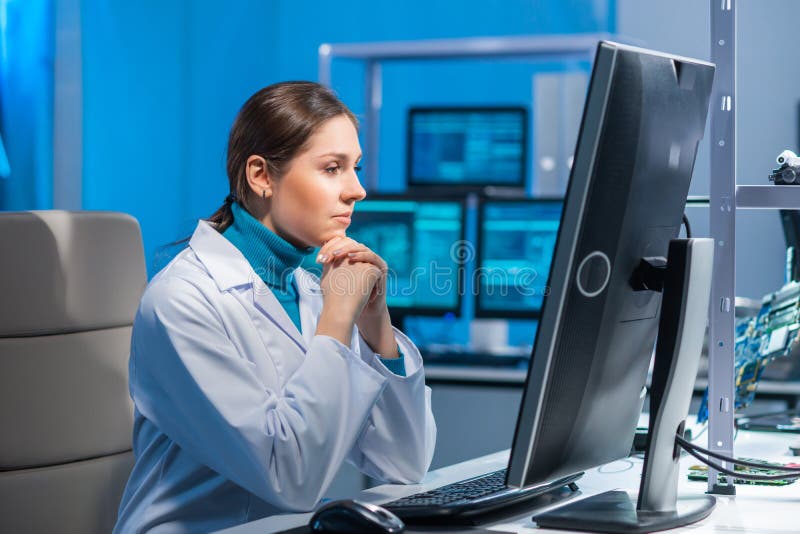 Female Microelectronics Engineer Works in a Scientific Laboratory on ...