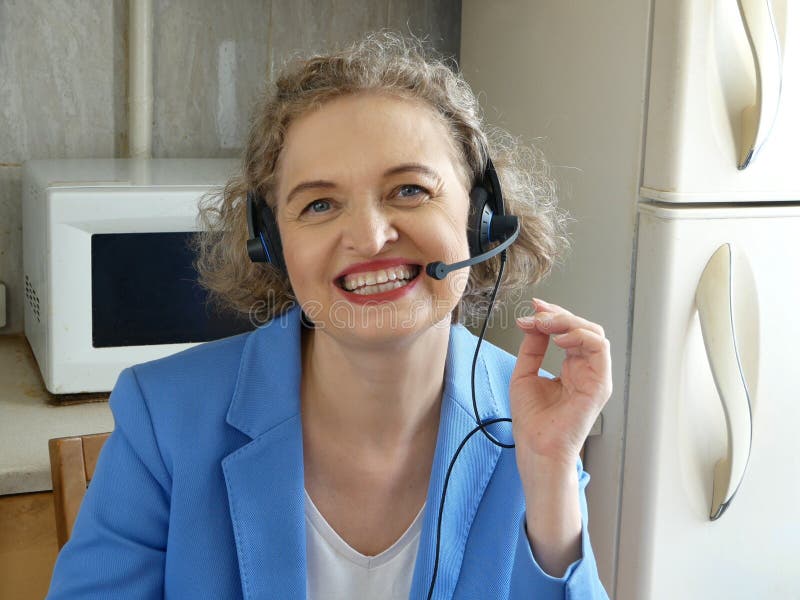 Female Middle Aged Technical Support Agent Working at Home at Kichen ...