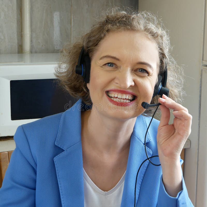 Female Middle Aged Technical Support Agent Working at Home at Kichen ...