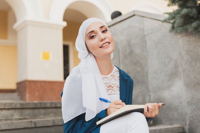 Female Middle Eastern College Student Sits on Stairs in University ...