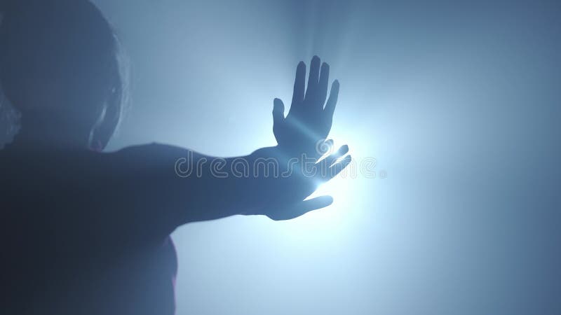 Female Model Against Bright Lightning on Black Background in Studio ...
