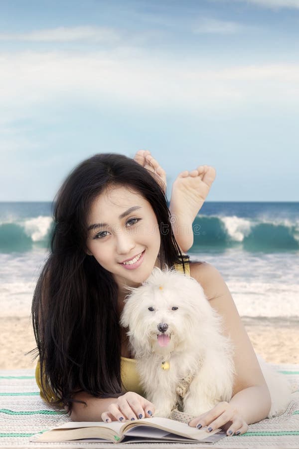 Female Model with Dog and Book at Shore Stock Image - Image of portrait ...