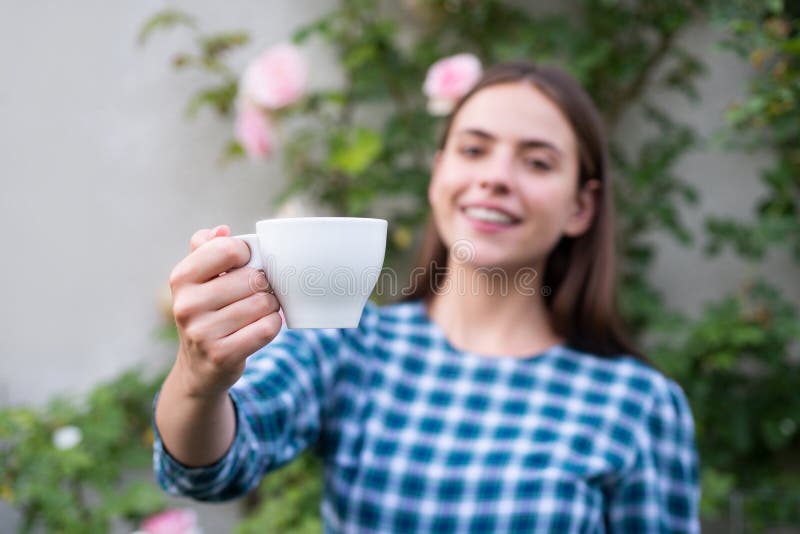Female Model Holding Cup of Coffee. Female Giving Coffee Stock Photo ... Female Model Holding Cup of Coffee. Female Giving Coffee Stock Photo ...
