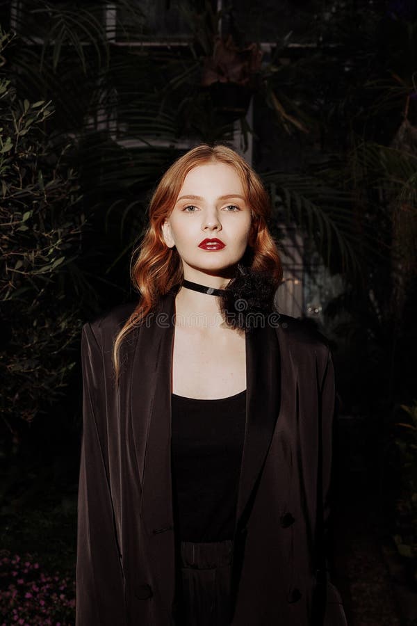 Female Model Illuminated by a Light Source Against a Background of ...